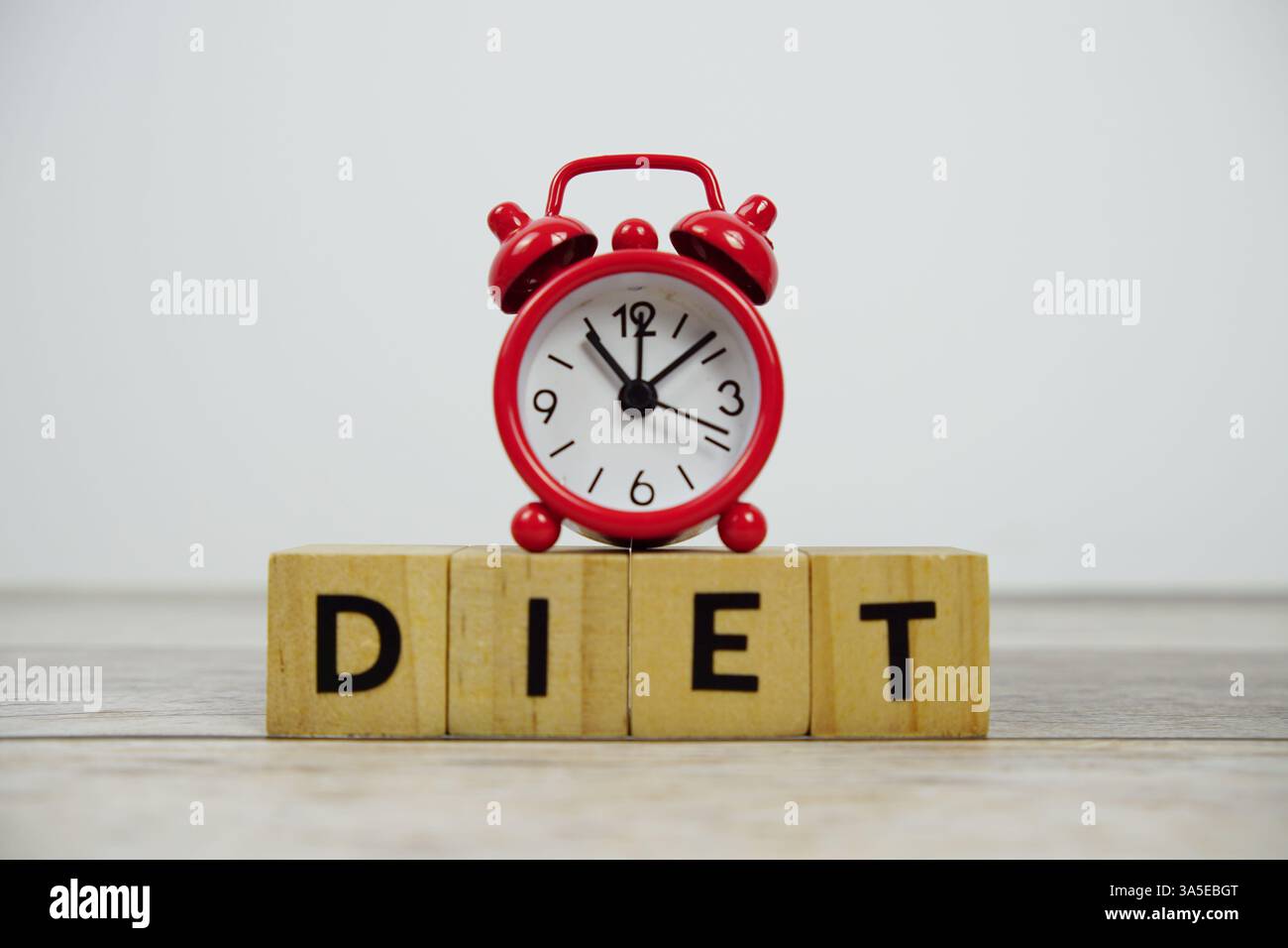 Time to Diet with wooden blocks alphabet letters and alarm clock on ...