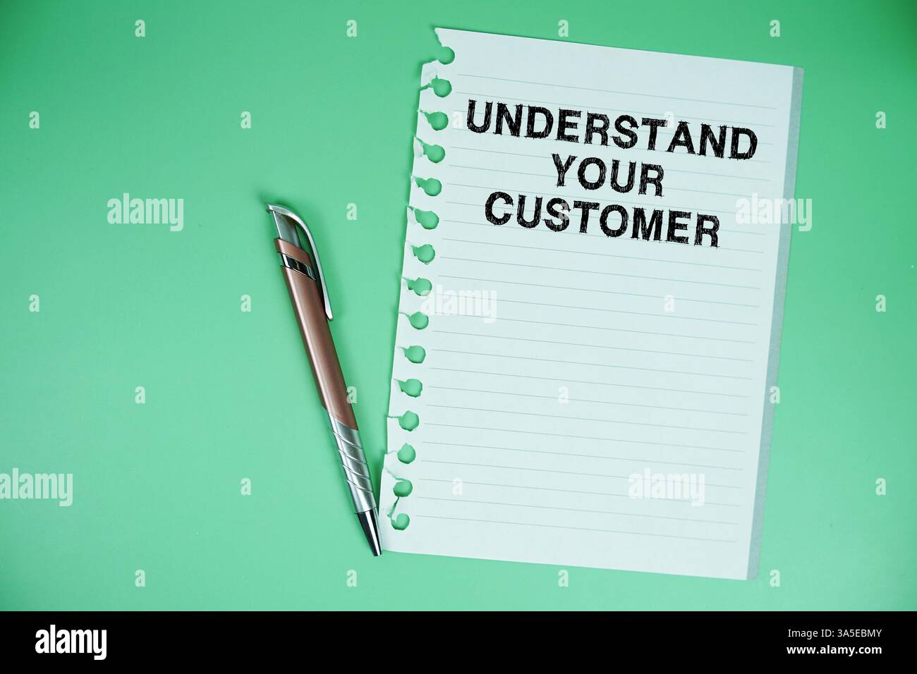 Understand Your Customer text written on paper with pen on green ...