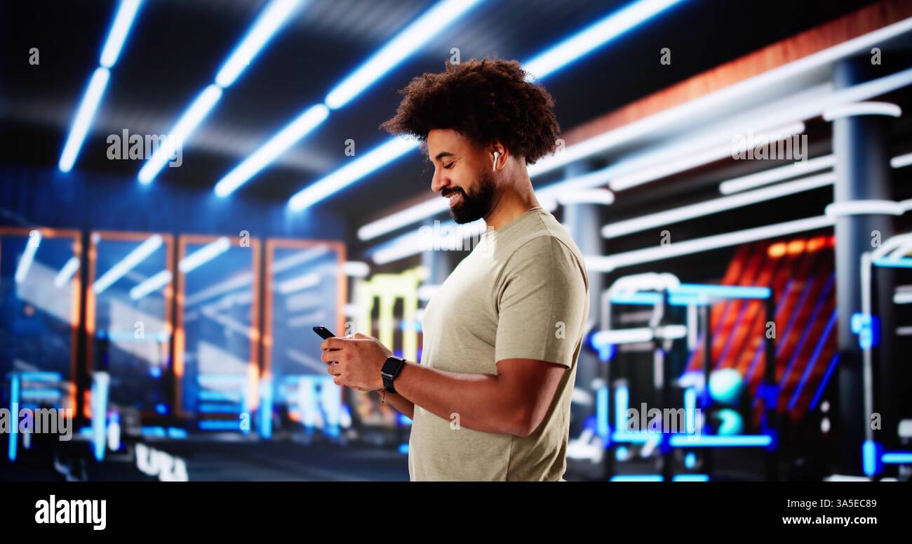 Personal Trainer Monitoring Client's Progress on Smartphone During Gym ...