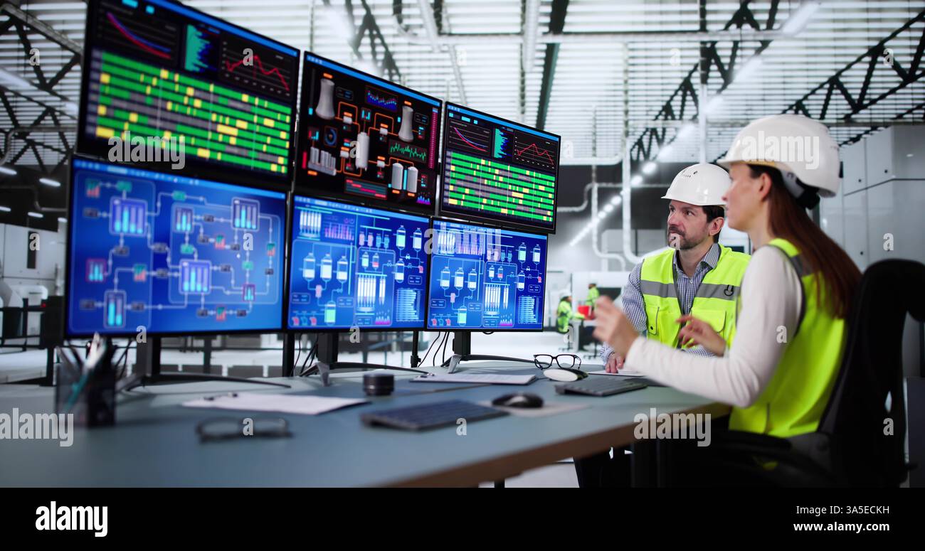 Woman and man using control software to monitor SCADA system Stock ...