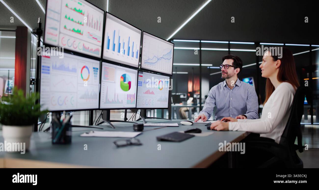 Business Analyst Man and Woman Using KPI Data Dashboard Stock Photo - Alamy
