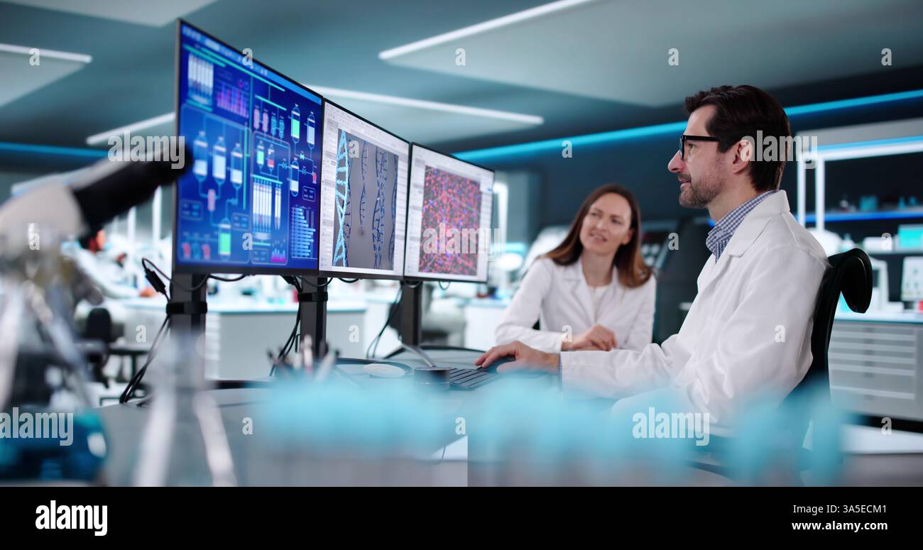 Female scientist using computer to research biotechnology in hospital ...