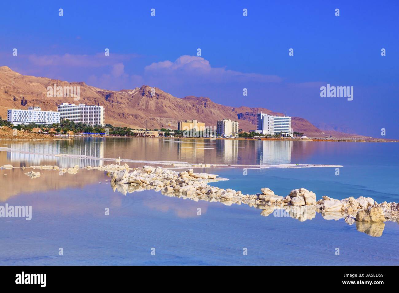 Decrease in water level in the Dead Sea. The evaporated salt acts over ...