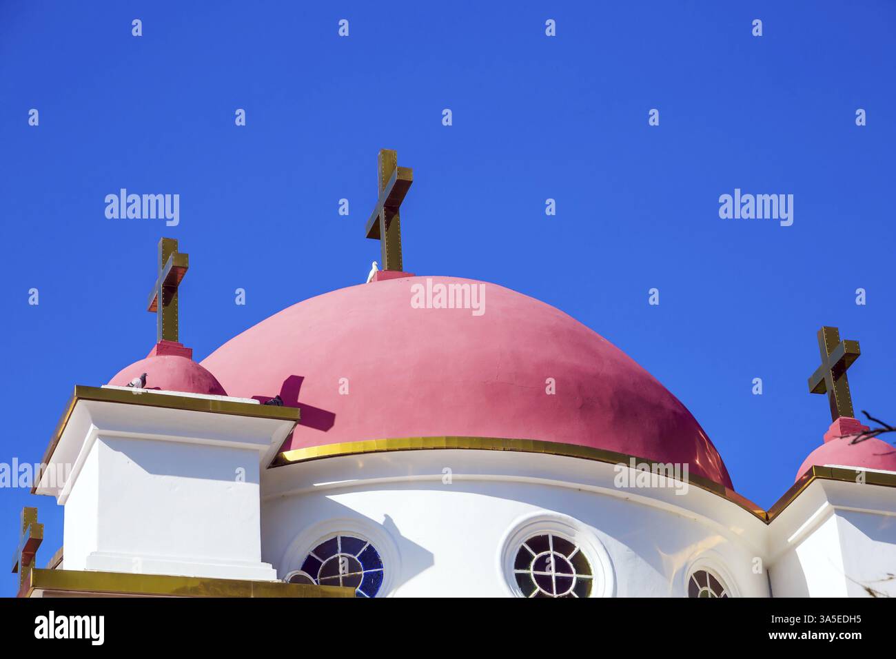 The Jerusalem Orthodox Church. Snow-white church building with pink ...