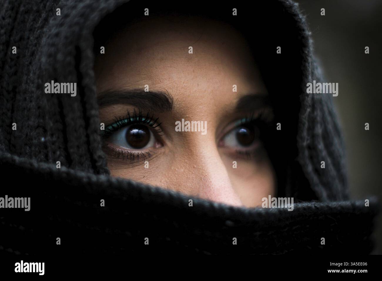 Closeup of the detail of the open eyes of a veiled woman made up Stock ...