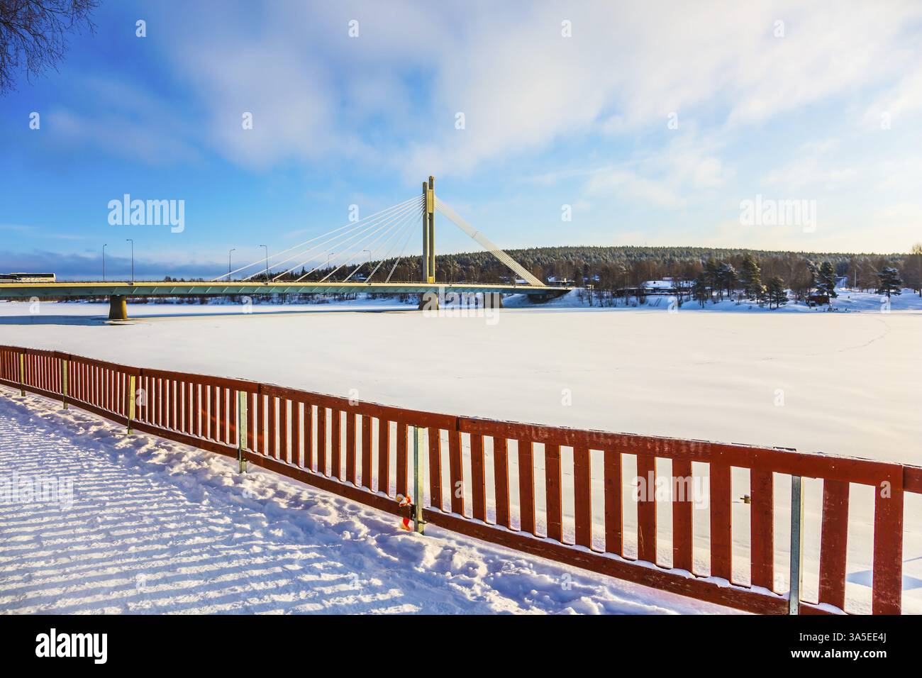 The bridge and the frozen river Kemijoki in the tourist town of ...