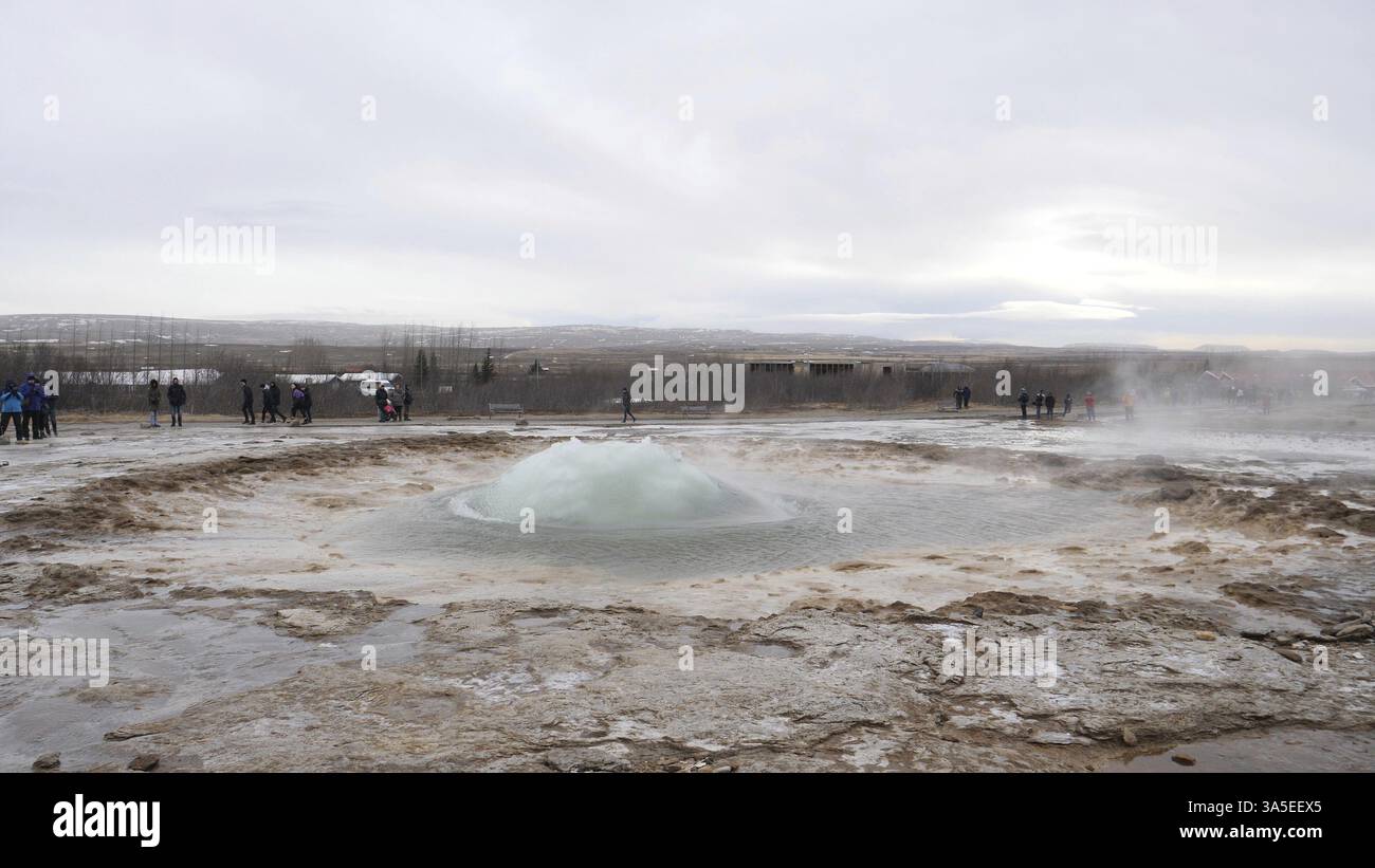Geyser erupting in Iceland, producing big splash of hot water and steam ...