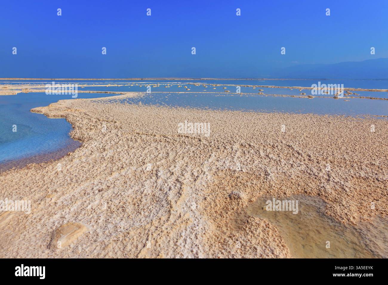 The evaporated salt acts over a water surface beautiful patterns ...