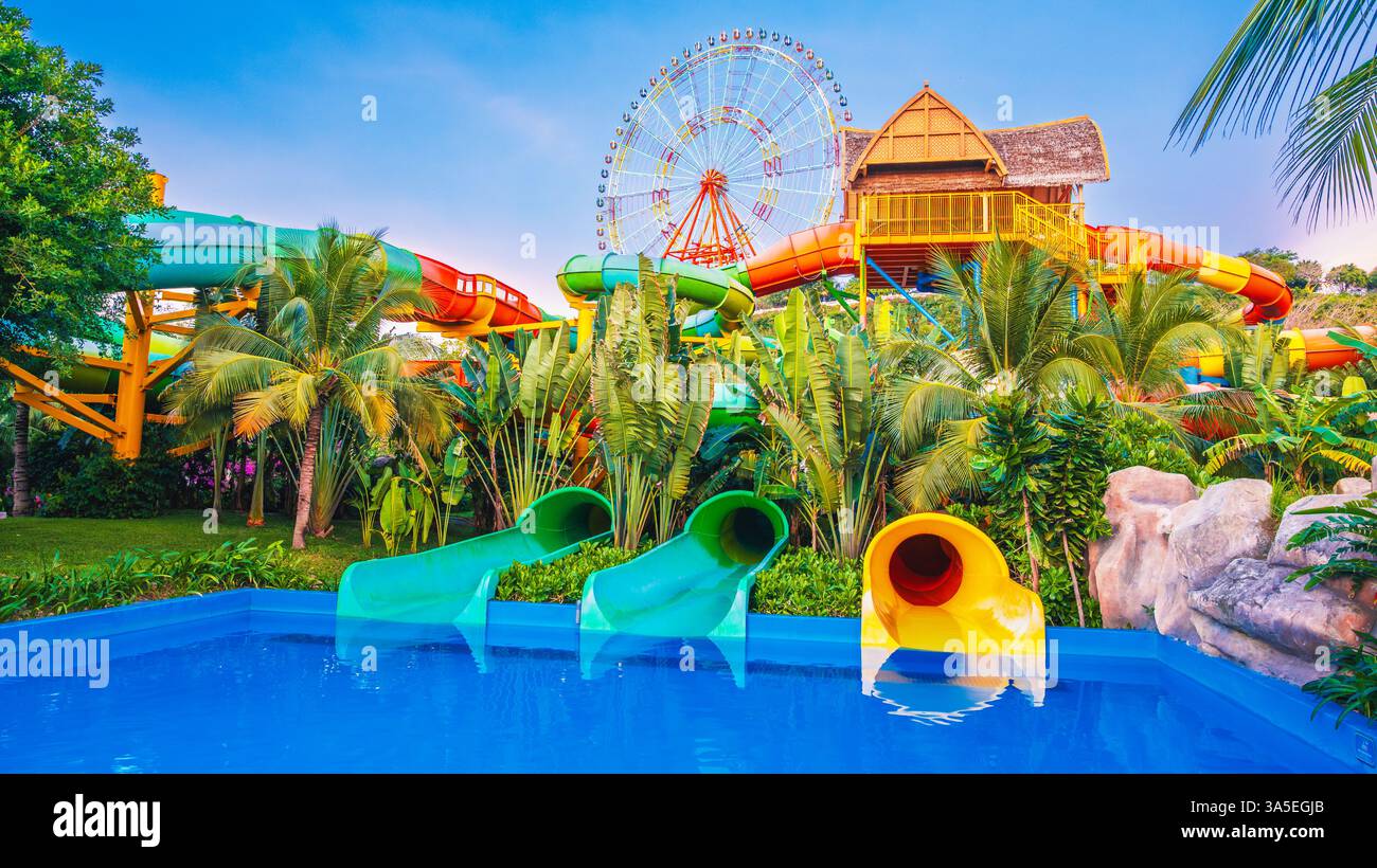 colorful aquapark with slides and a swimming pool at resort in summer ...