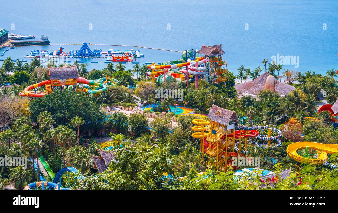 big water park with slides and a swimming pool at resort in summer ...