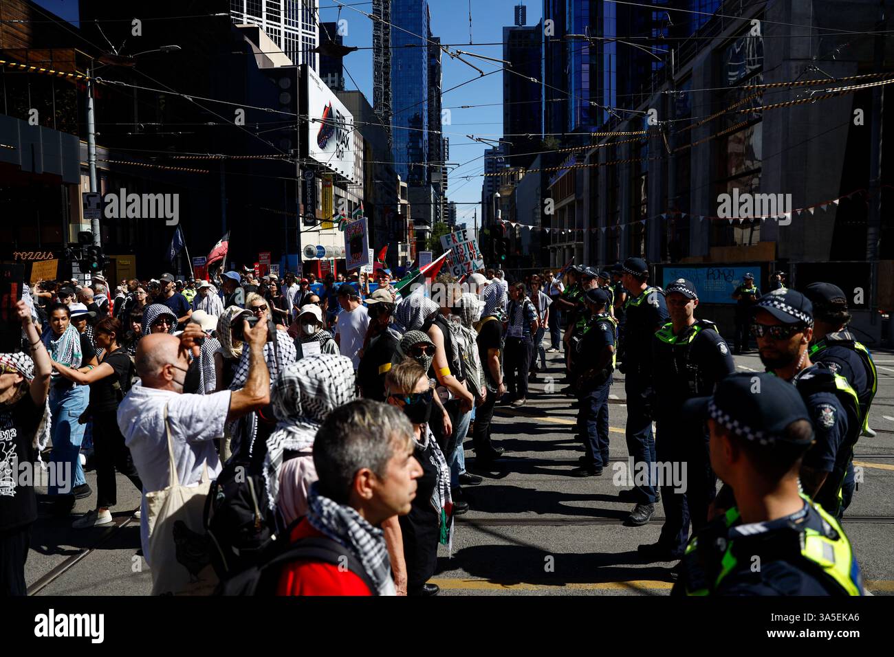 Police line blocks the street during the rally, controlling the protest ...