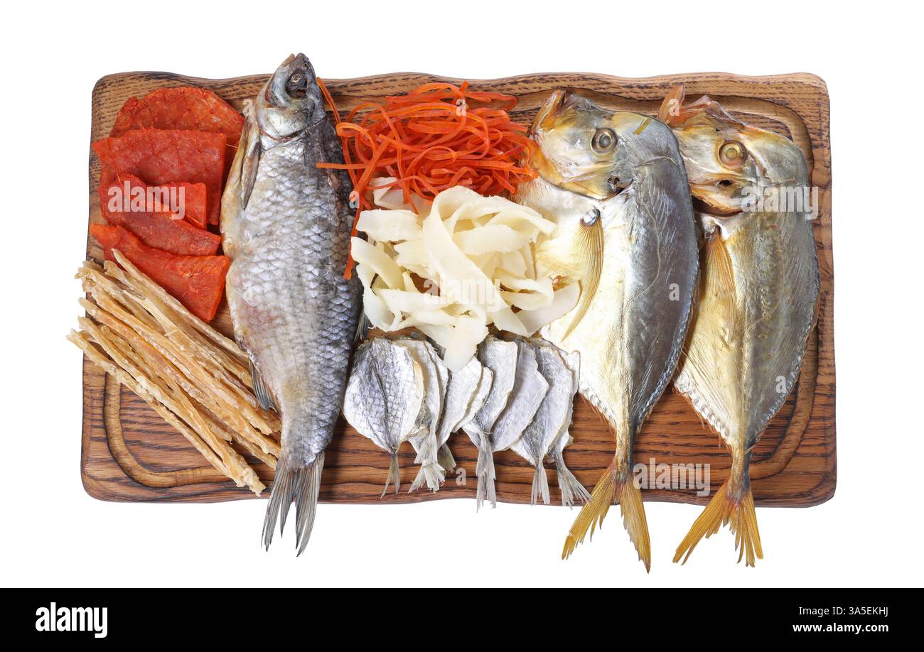 Many different dried fish snacks isolated on white, top view Stock ...