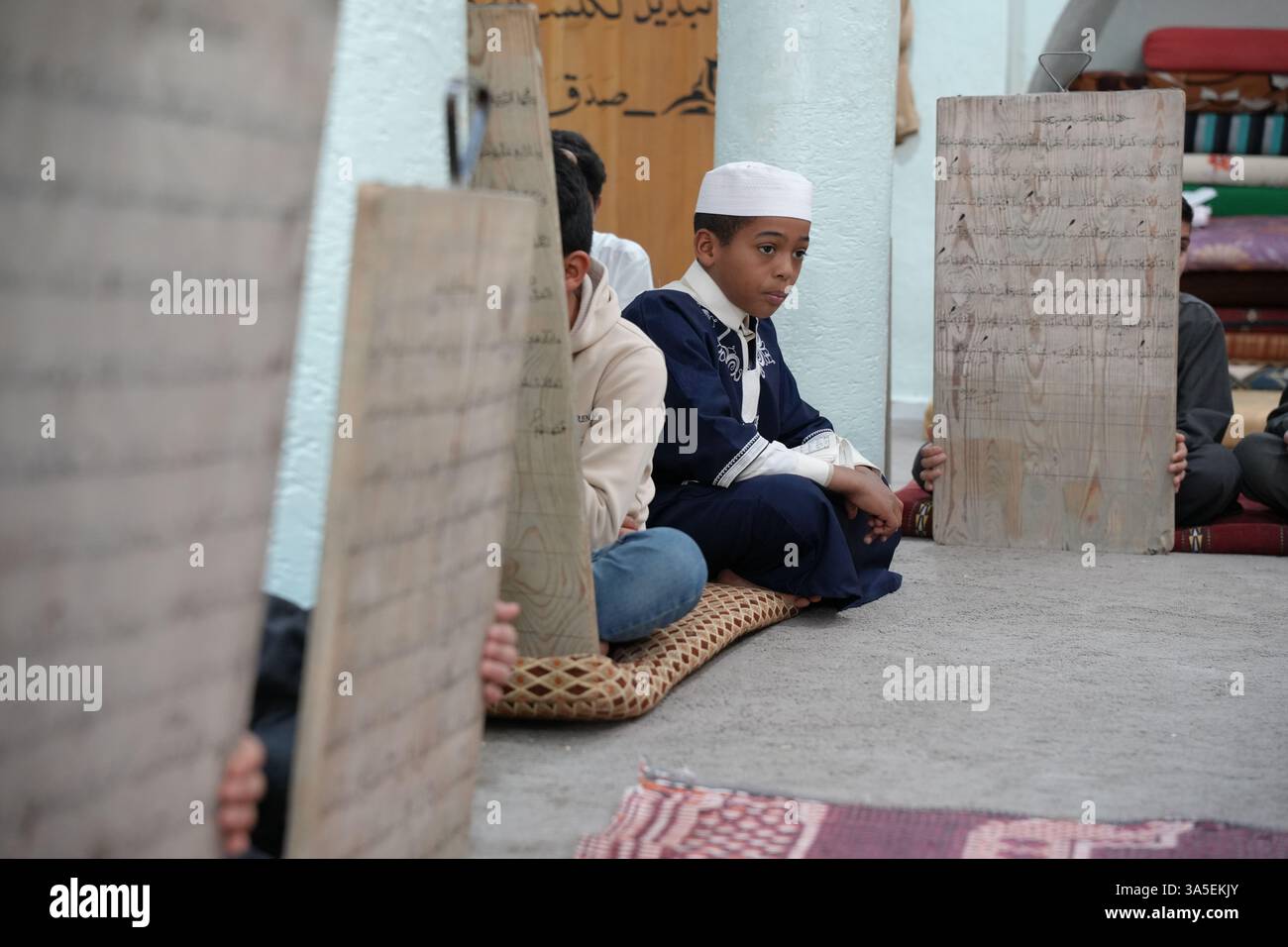 The teacher sits at the center of the circle, guiding his students as ...