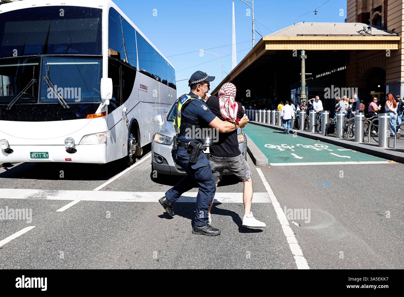 Victoria Police attempts to stop protesters during the rally. The rally ...