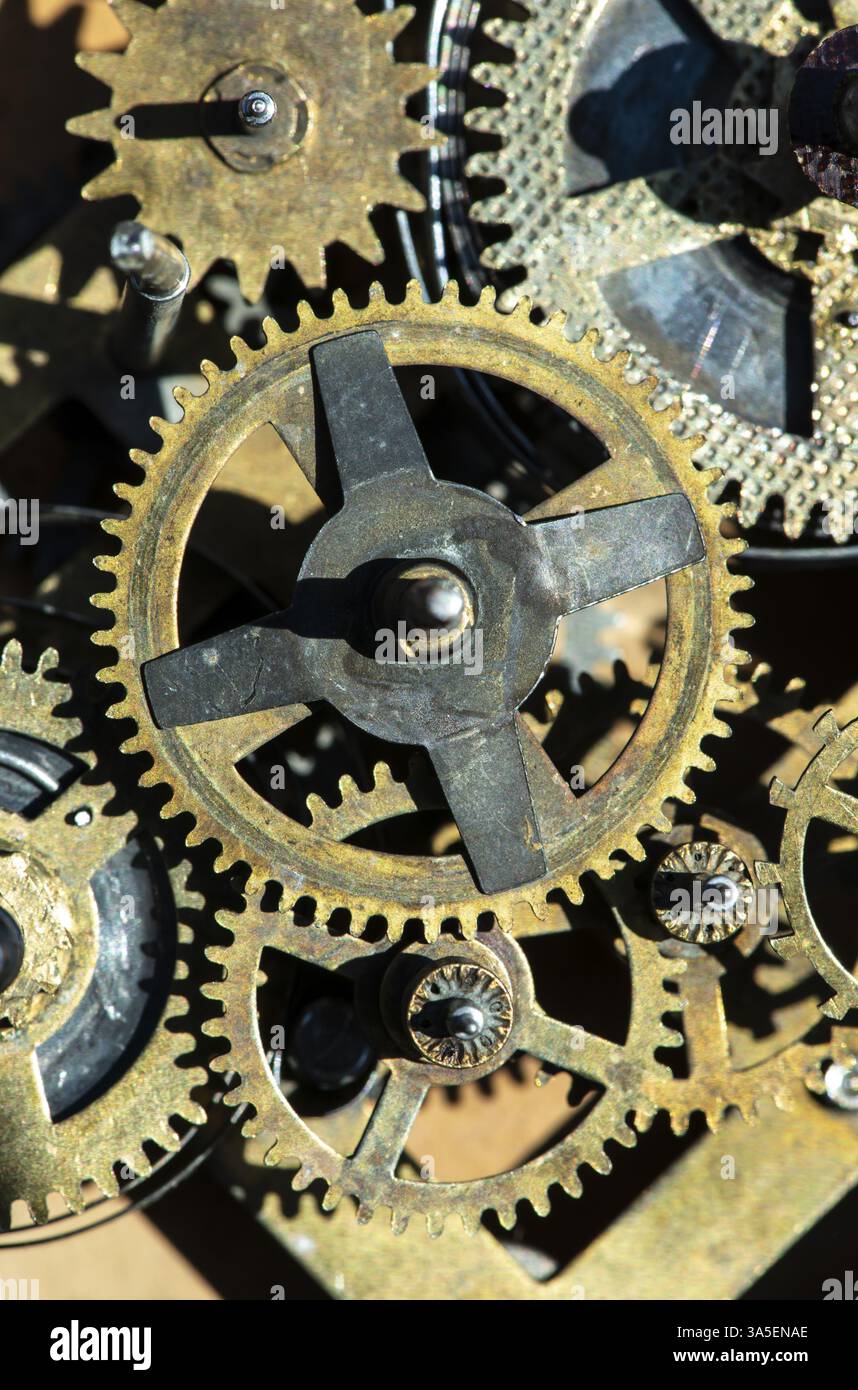 Close up metal gears mechanism. Golden colours. Hard light. Clock ...