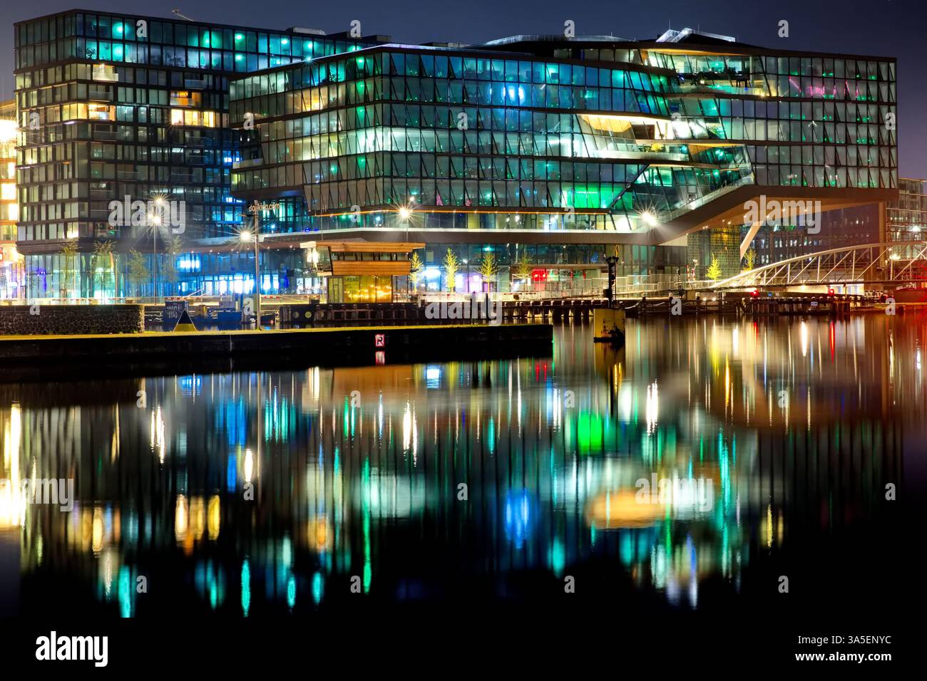Night view of the Booking.com campus in Amsterdam with vibrant lights ...