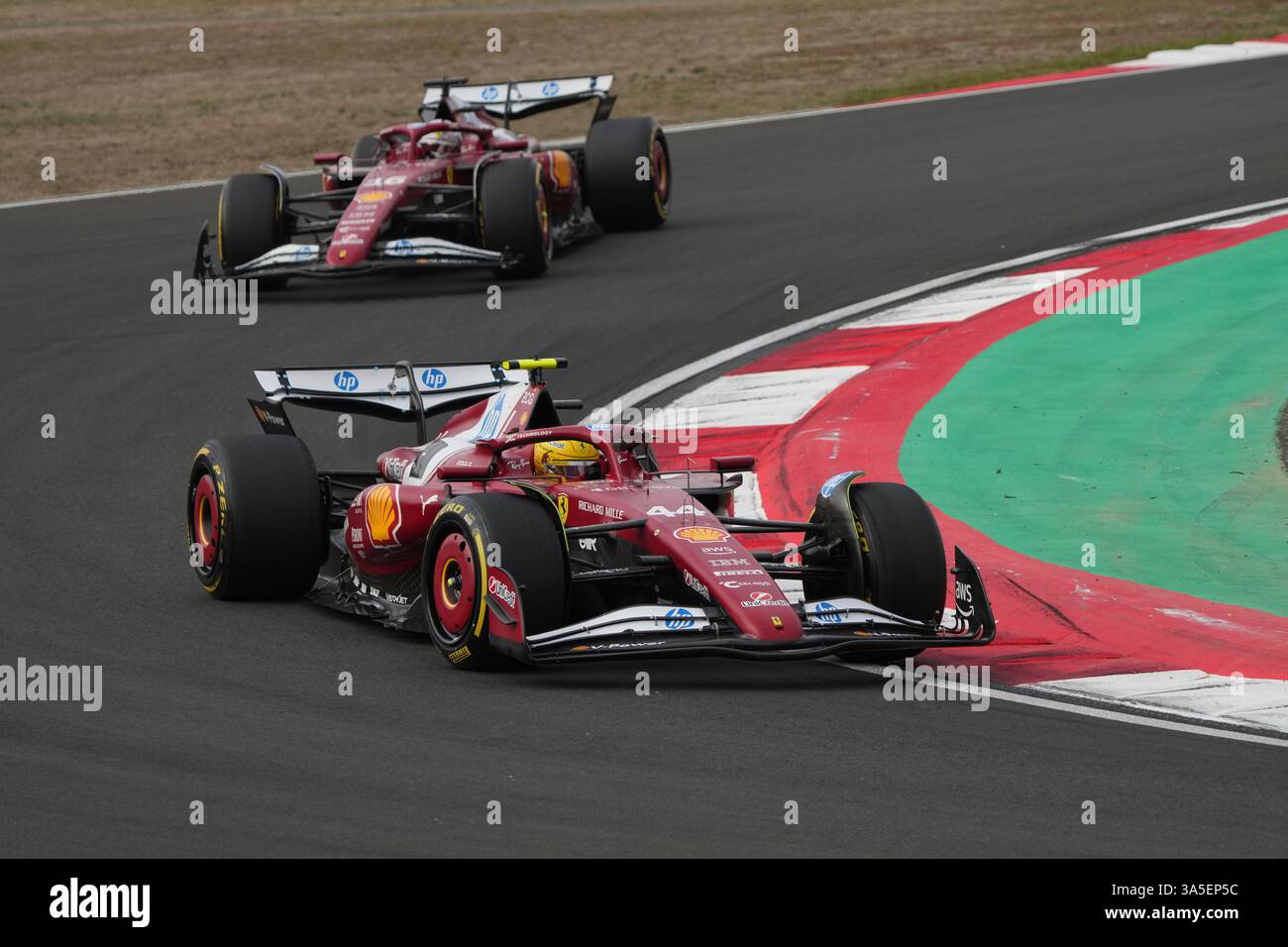 Ferrari driver Lewis Hamilton of Britain steers his car during the ...