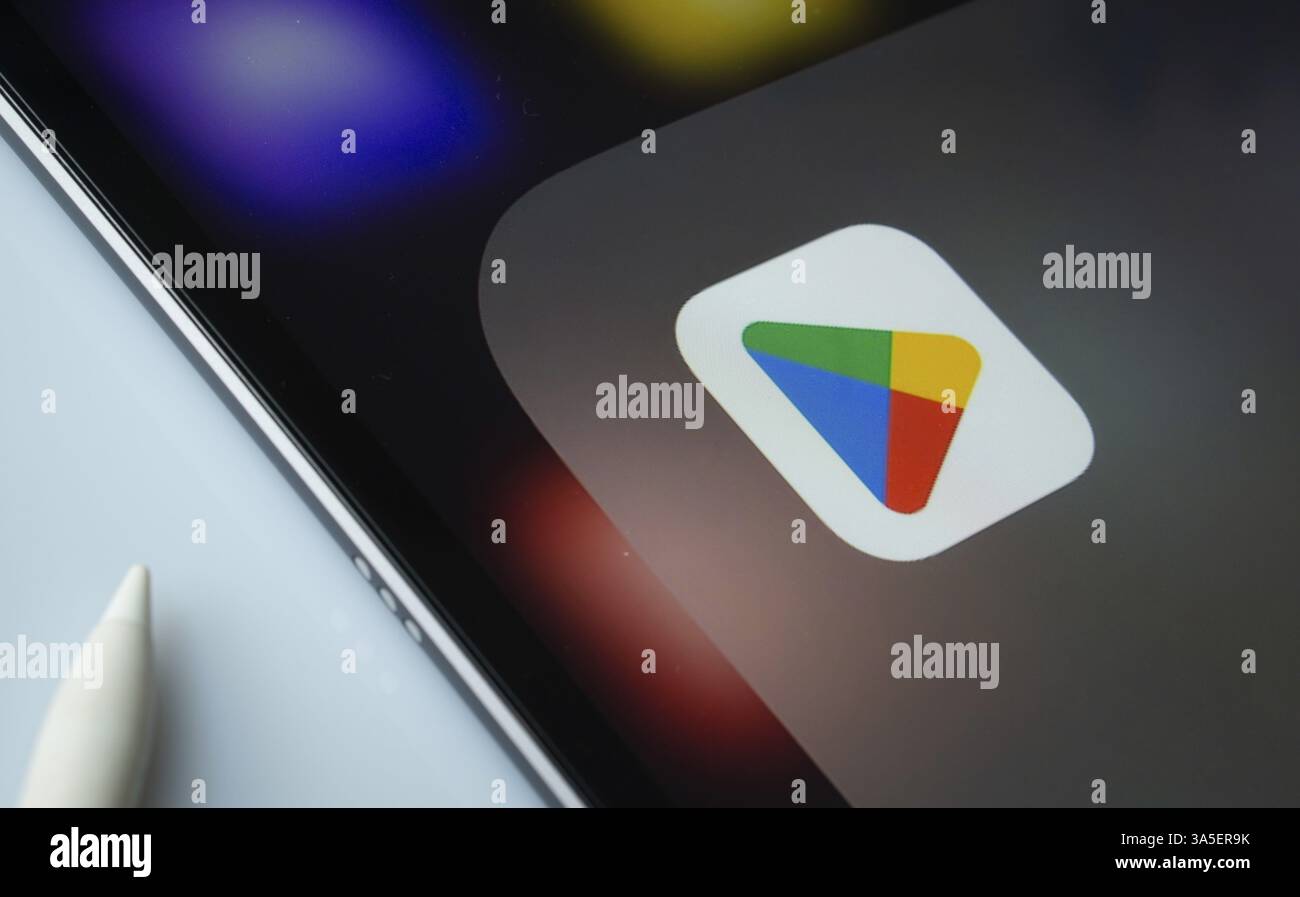 A close up of an iPad screen displaying the Google play app Stock Photo ...