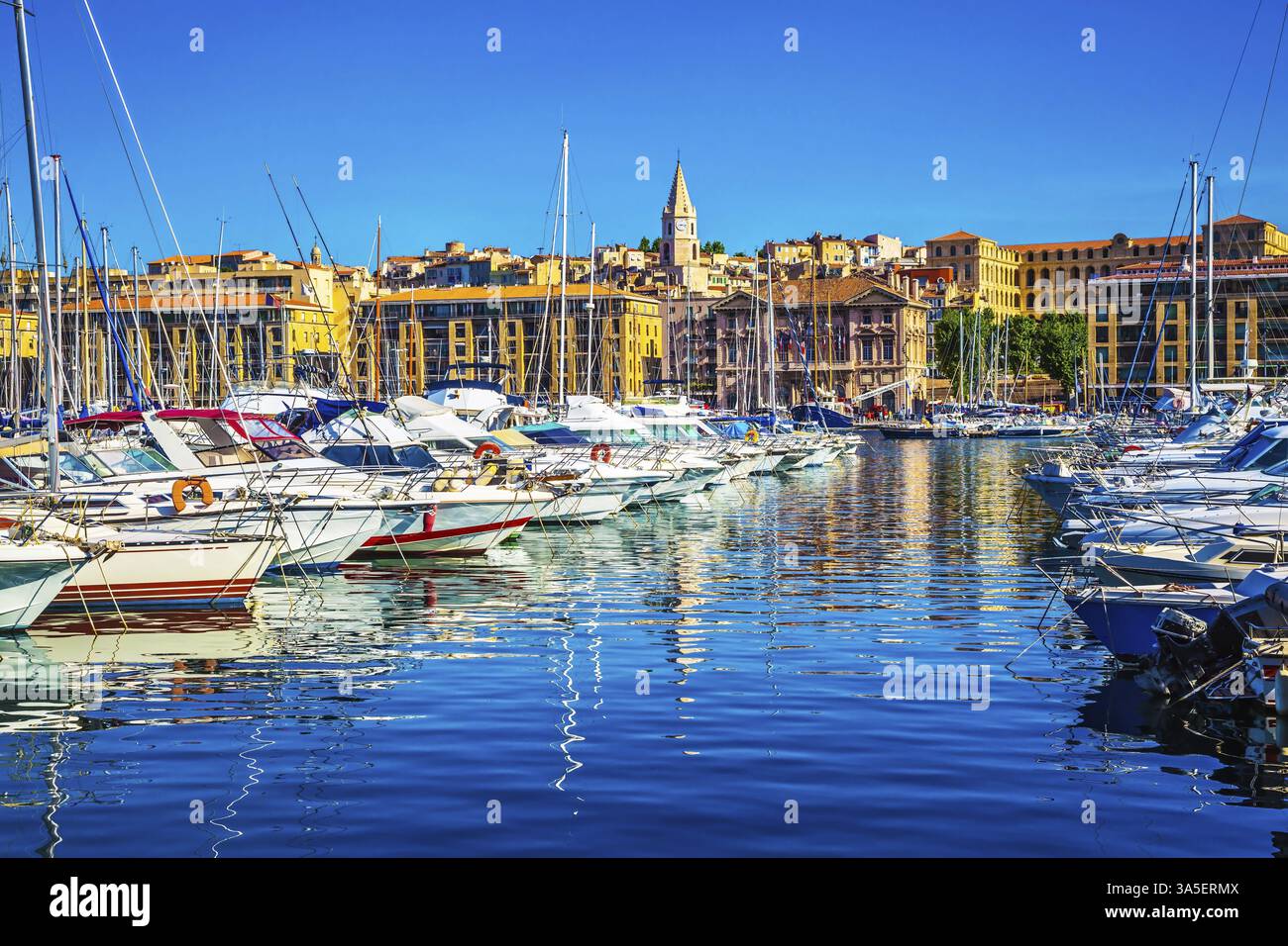 The blue water reflects the ancient buildings on the waterfront. Rows ...