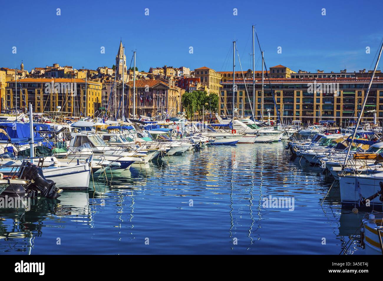 The water area of Marseille Old Port. The blue water reflects the ...