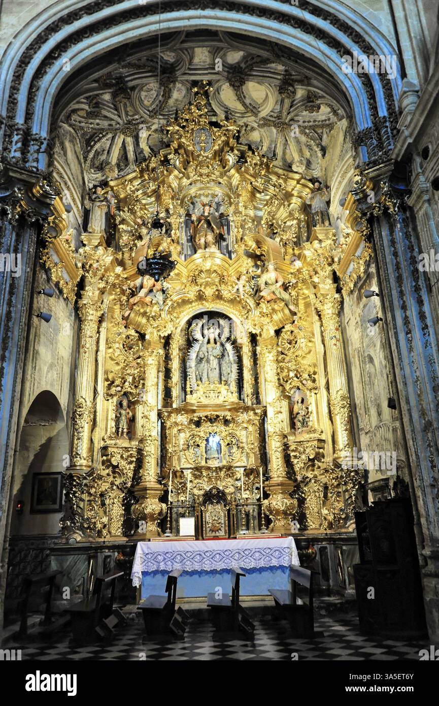 Magnificent gilded altar in Baroque style with symmetrical decorations ...