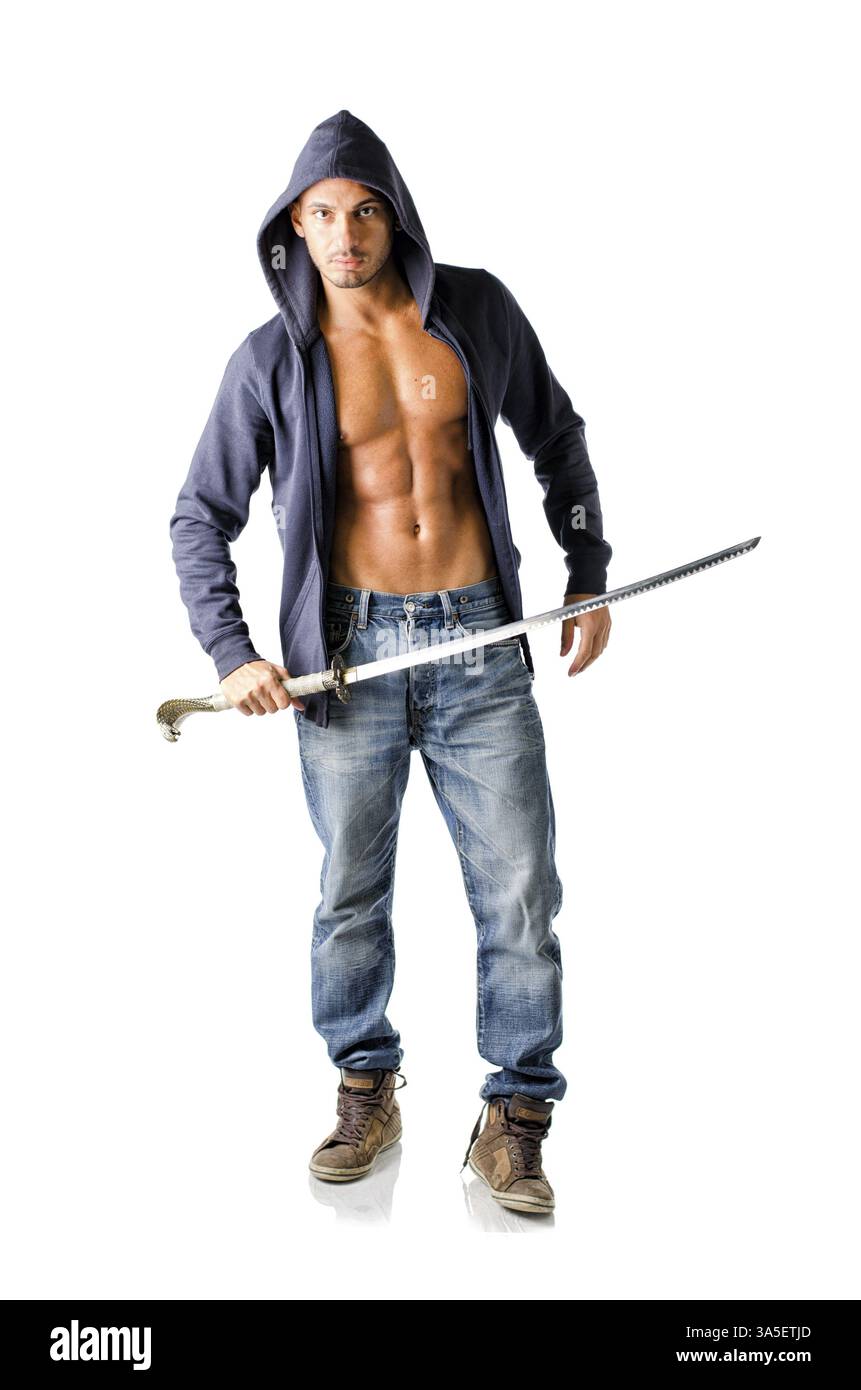 Full body shot of attractive young man in sweatshirt holding japanese ...