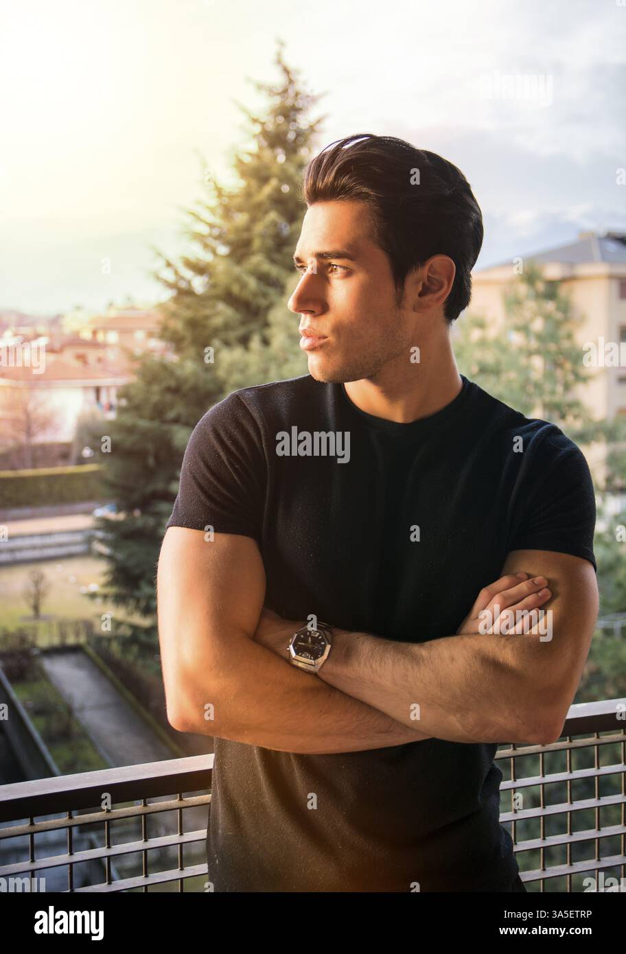 Profile of handsome attractive young man outdoor, looking to a side ...