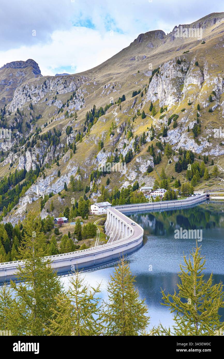 The grand dam raises the water level in the lake. Lago di Fedaya ...