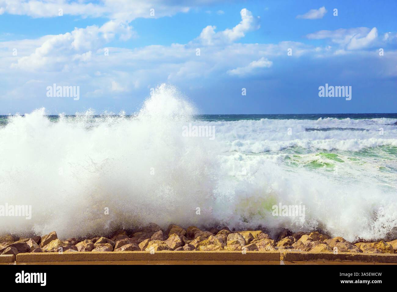 Huge six-meter waves with crests of white foam collapse at the Old Port ...