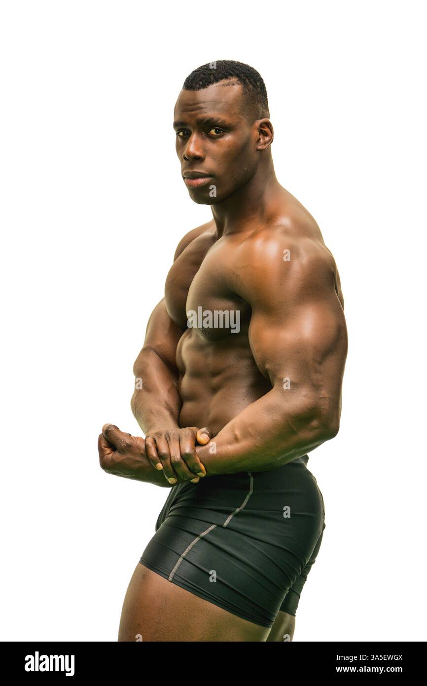 Handsome black male bodybuilder posing in studio isolated, side chest ...