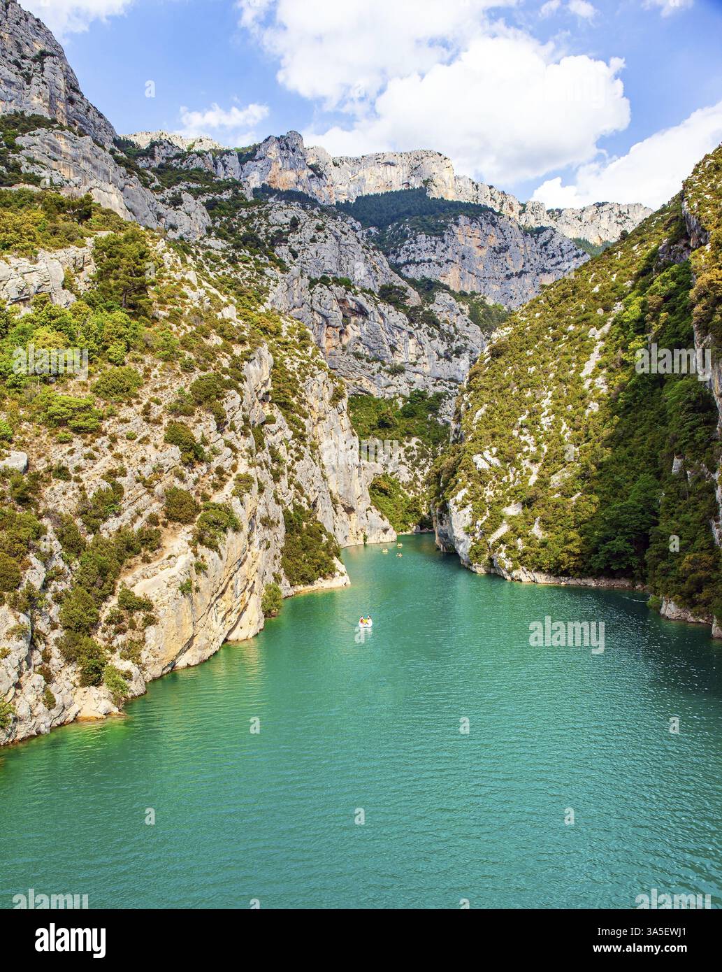 Tourist boats and catamarans float along the river. Beautiful French ...