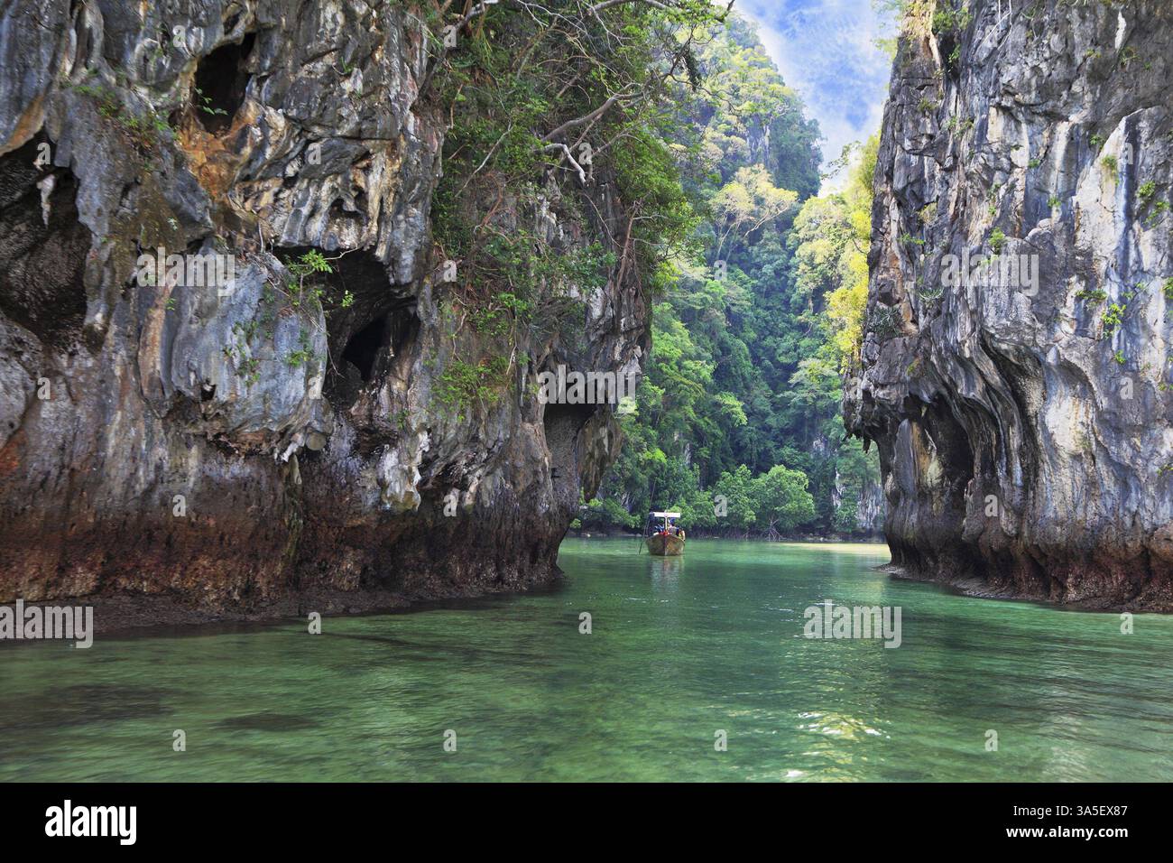 The Thai excursion boat swims in a picturesque bay Stock Photo - Alamy