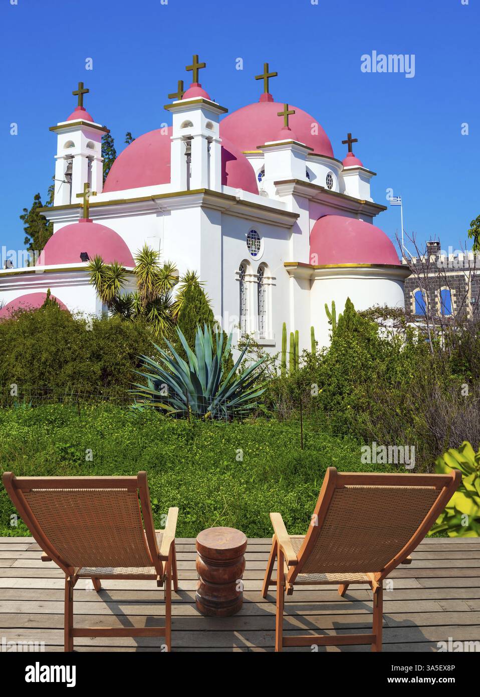 Snow-white church with pink domes. The Monastery of the Holy Twelve ...