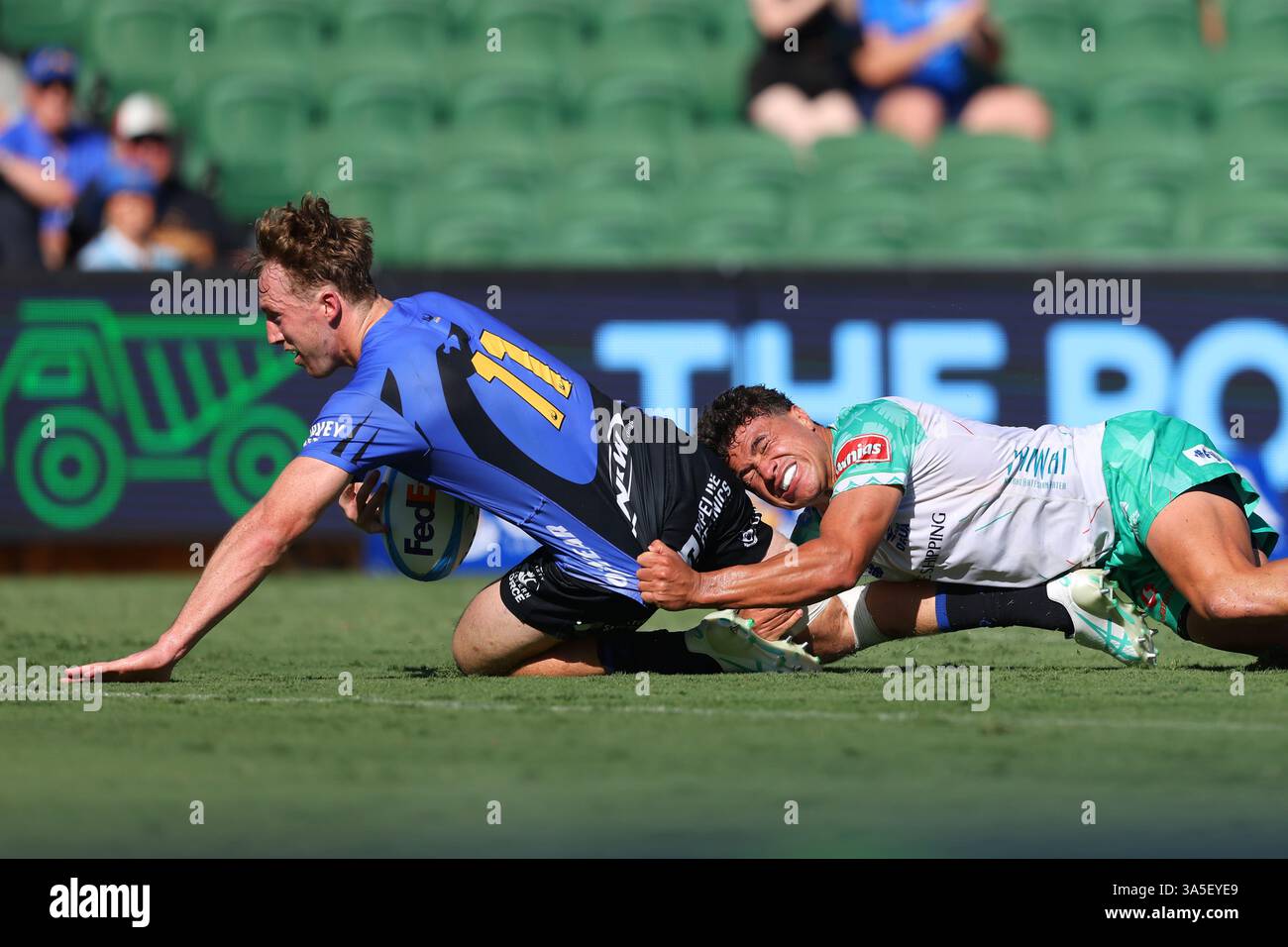 Harry Potter of the Western Force evades Caleb Muntz of Drua to score a ...