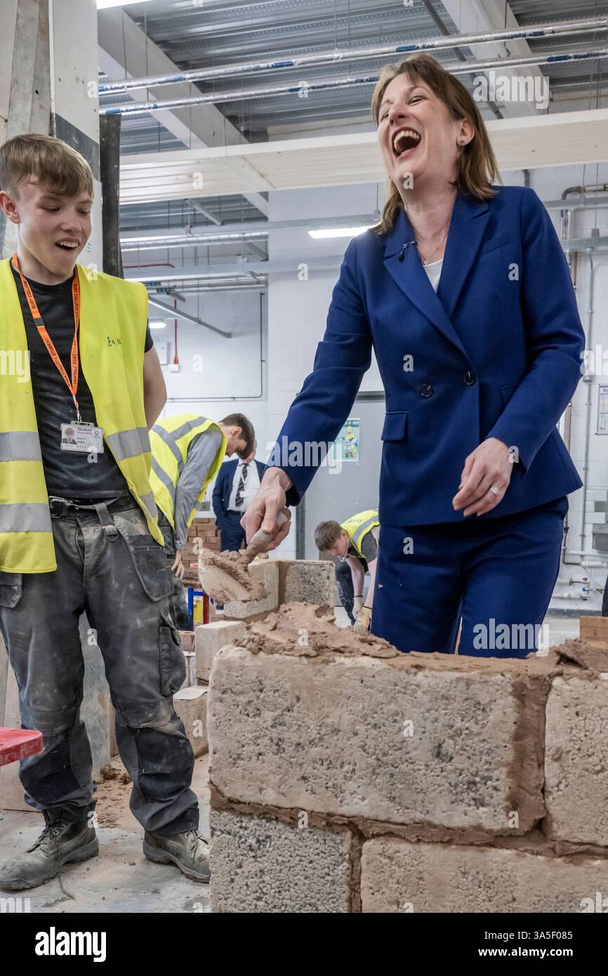 Chancellor of the Exchequer Rachel Reeves lays mortar on to bricks with ...