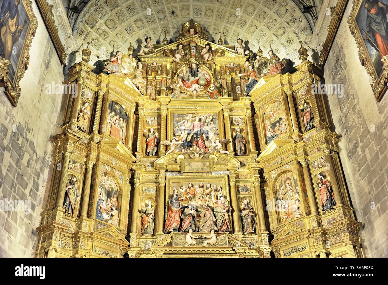 Sublime baroque altar with detailed paintings and golden decorations in ...