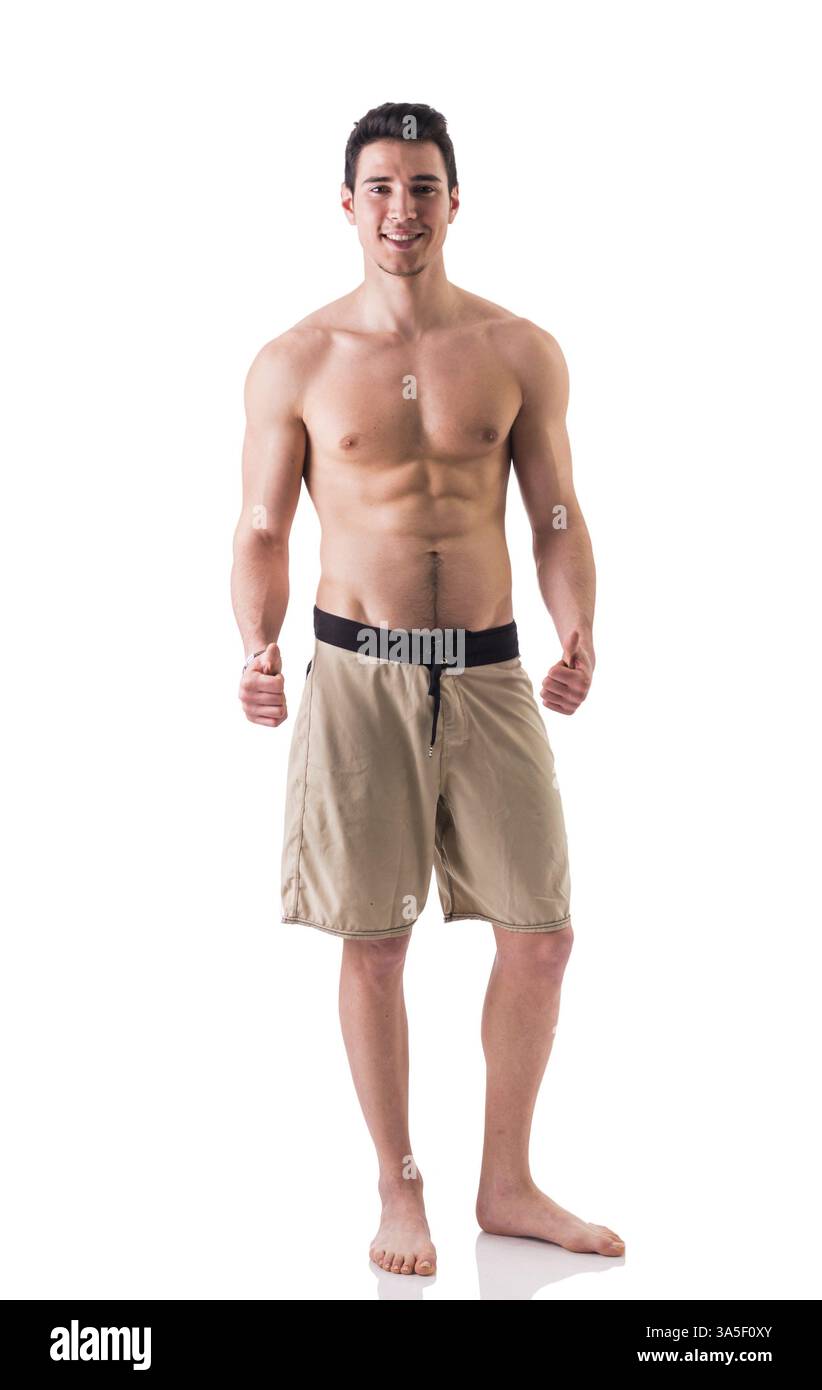 Handsome guy wearing stylish half shorts isolated in white, doing ...