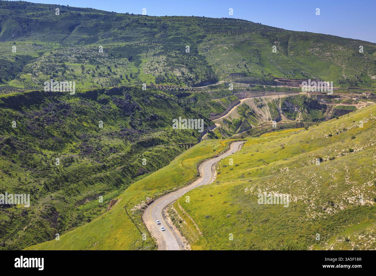 Serpentine road winds through the green hills. Israel's border with ...