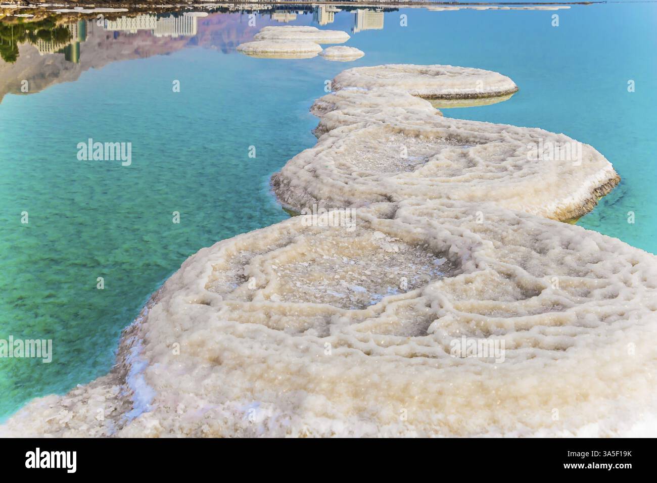 Morning at the resorts of the Dead Sea. Picturesque white paths from ...