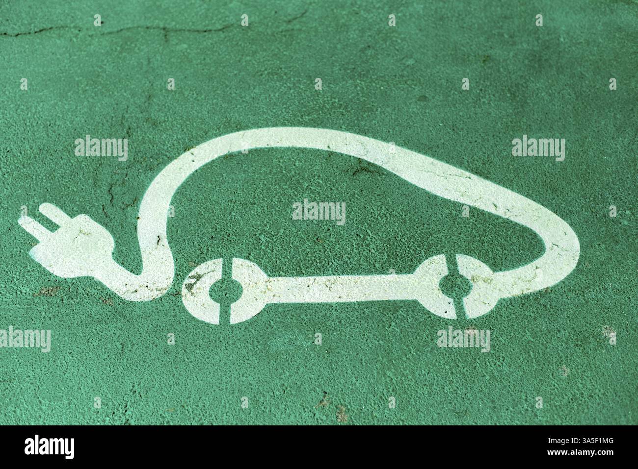 Electric charge station. Car charging symbol painted on asphalt ...