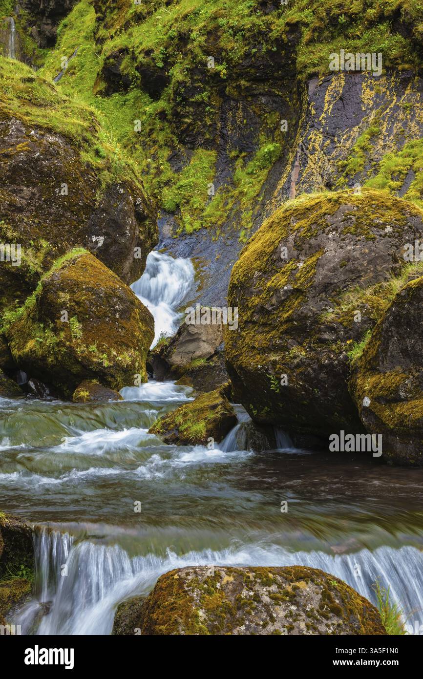 Iceland. Gorgeous cascading waterfall from melting glacier. Basalt ...