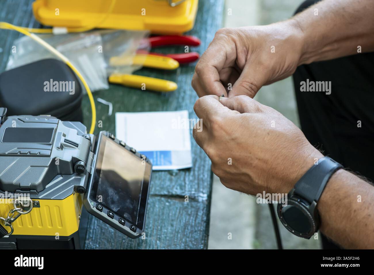 Device for mounting optical cable. Optical internet Technology concept ...