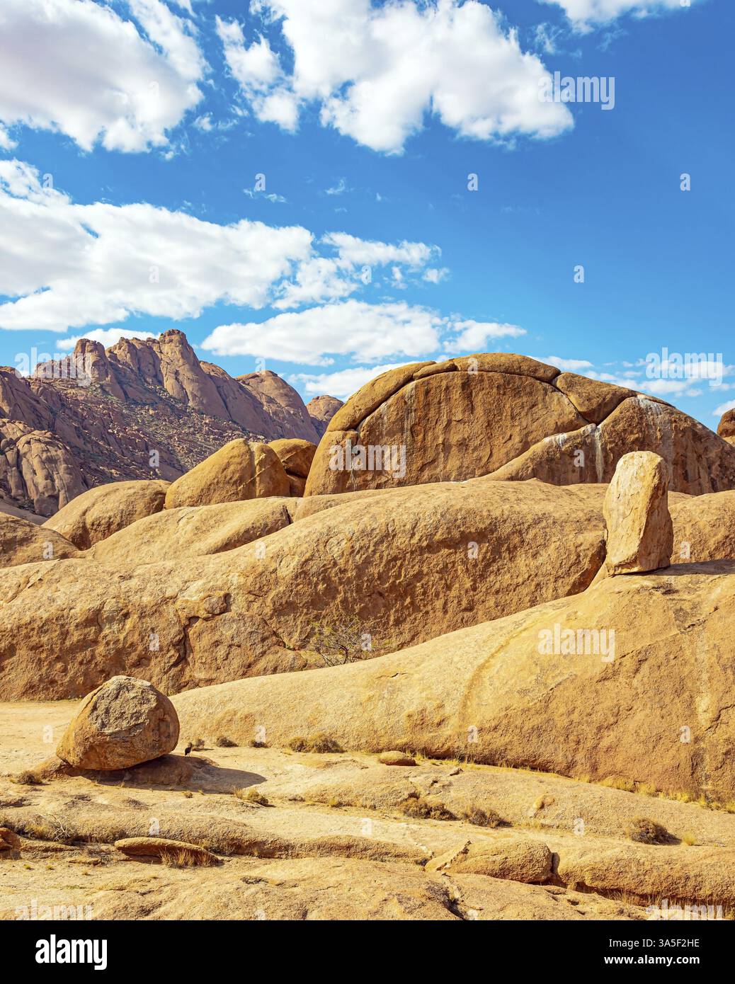 Huge rounded boulders in the middle of the endless Namibian desert. Adventurous journey to an ...