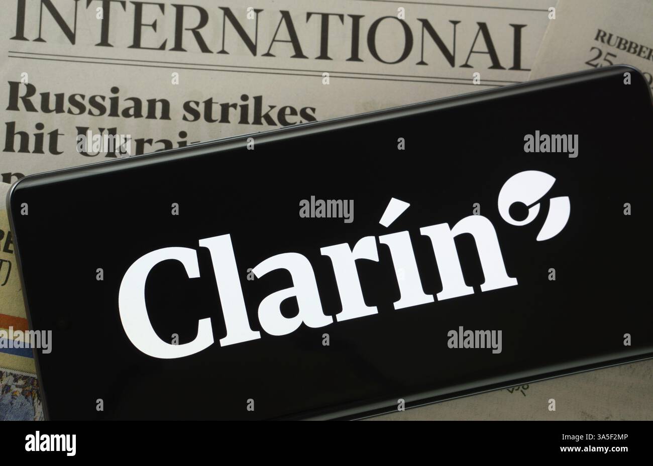 The logo of the Clarin is displayed on a smartphone screen Stock Photo ...
