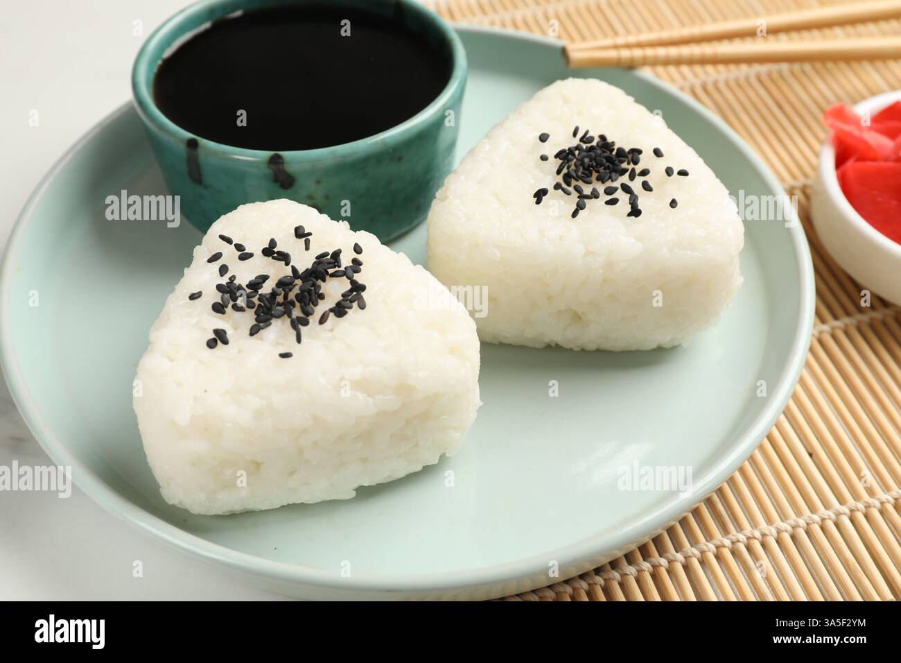 Rice balls (onigiri) served on table, closeup. Traditional Japanese ...