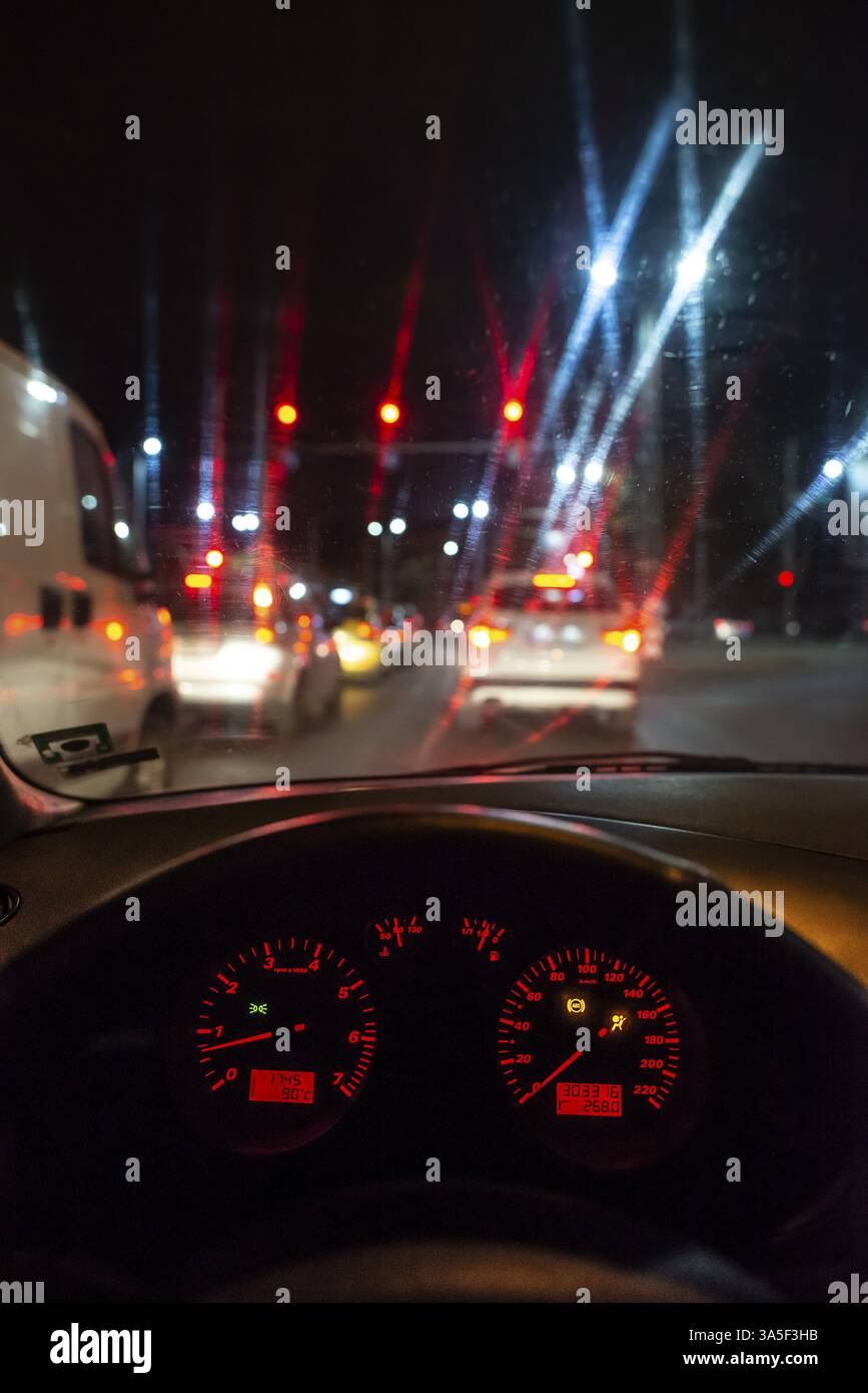 Car dashboard and window at night. Traffic lights Stock Photo - Alamy
