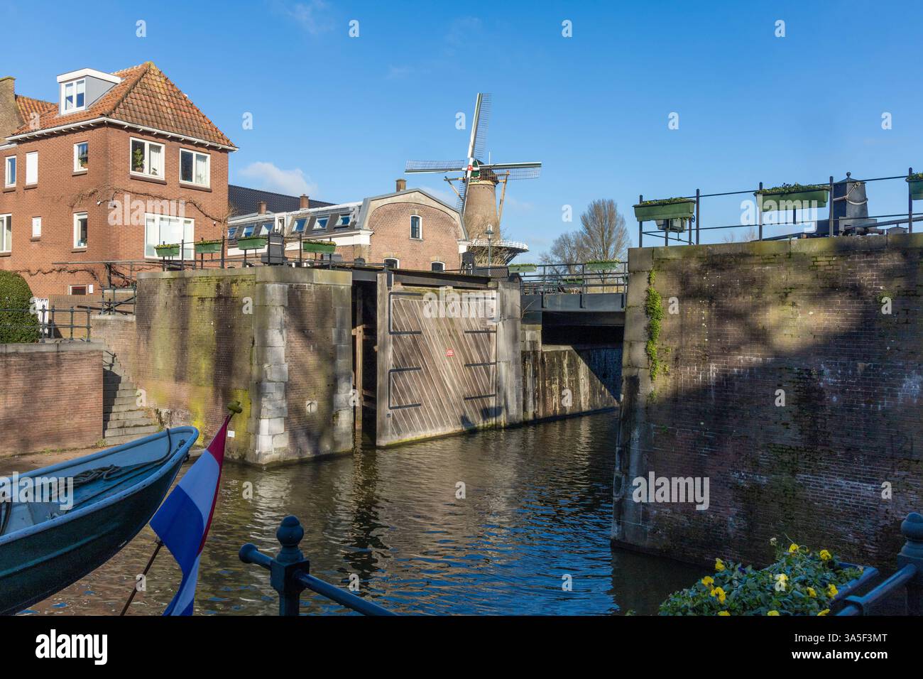 Windmill with the name “Molen Nooit Volmaakt'' is one of the two flour ...
