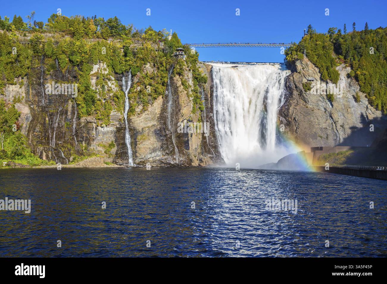 Magnificent rainbow in the waterfall Montmorency in Montmorency Falls ...