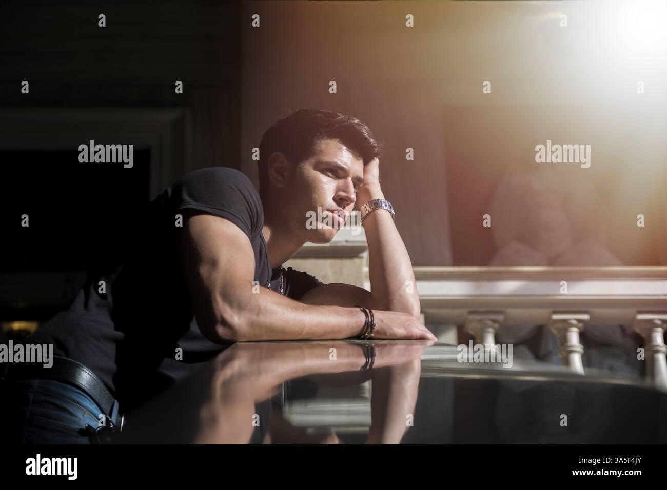 Portrait of Shy Attractive Young Man Leaning on Folded Arms Against ...