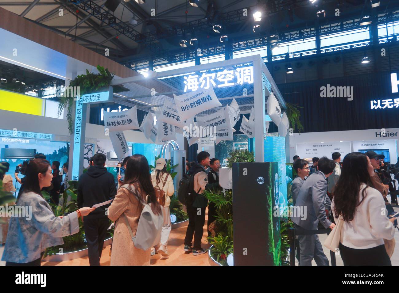 Visitors visit the booth of Haier Group at 2025AWE in Shanghai, China ...